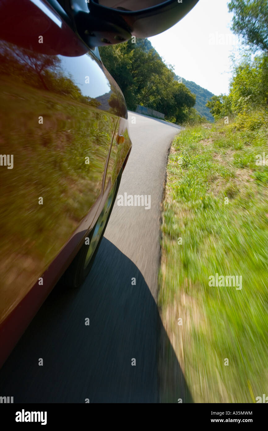 On road outside of car with door surface reflection landscape scenery ...