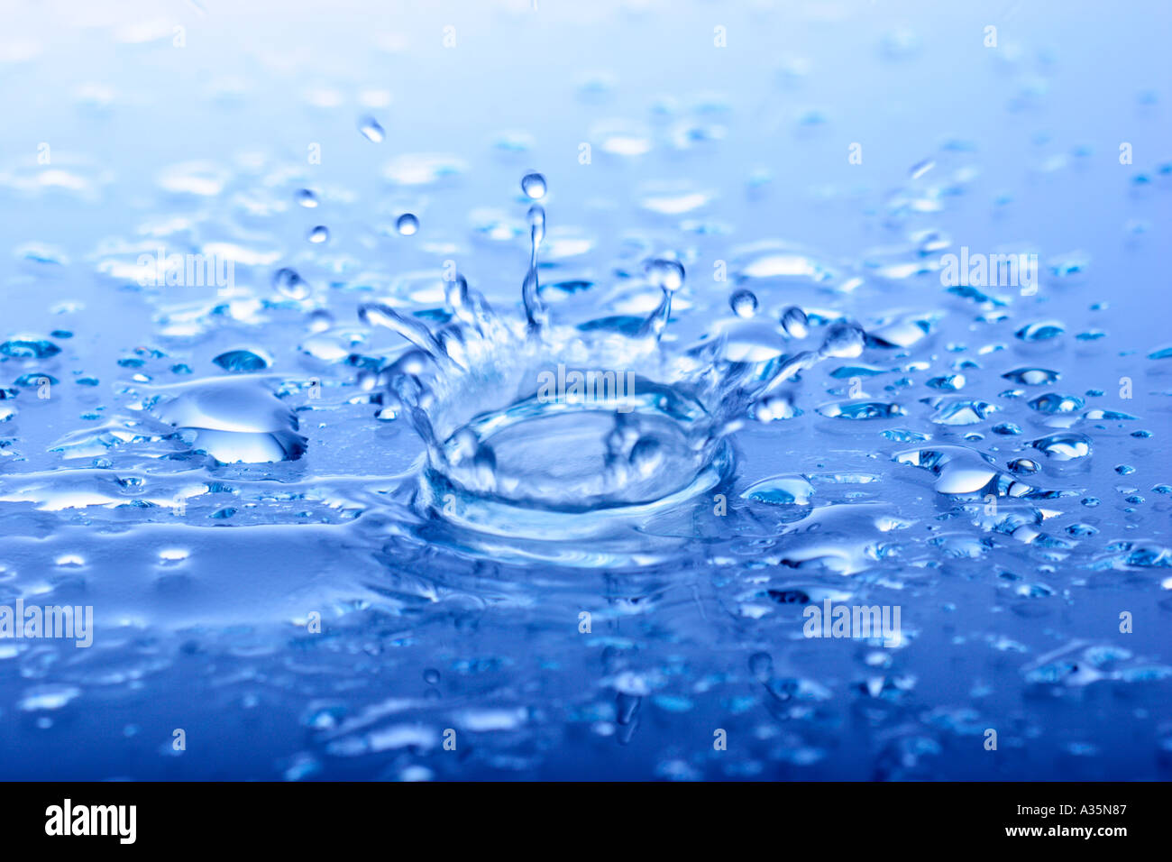 Drop of water splashing Stock Photo - Alamy