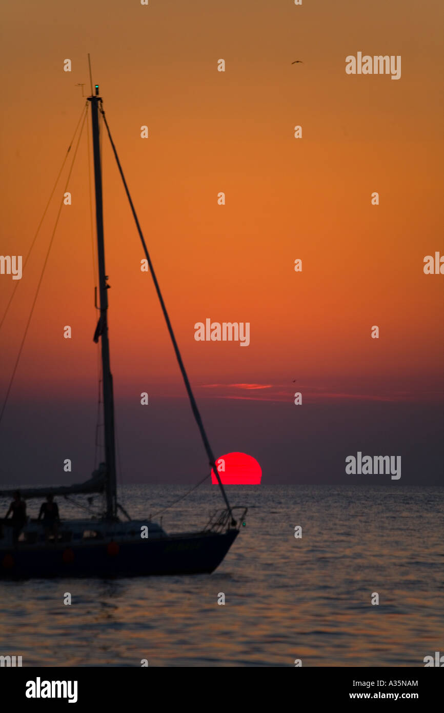 Boat and sunset Stock Photo - Alamy
