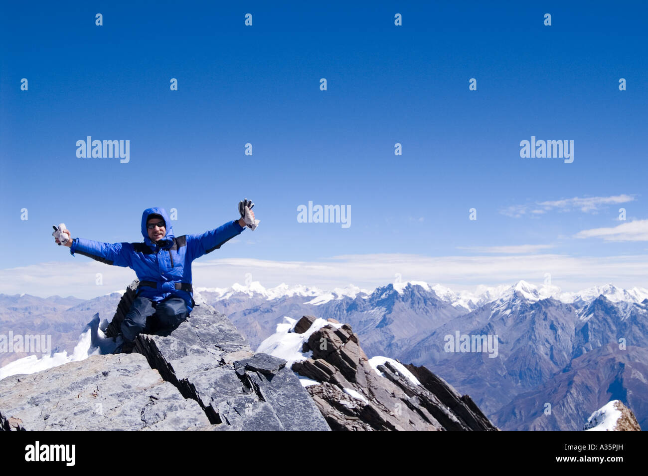 Climber sitting on top of the world hi-res stock photography and images ...