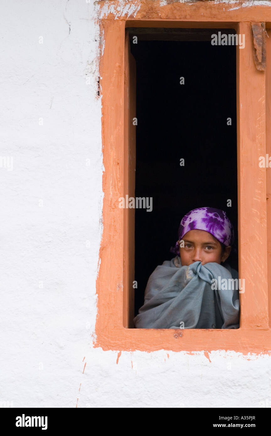 young girl with covered face framed in a window Stock Photo - Alamy