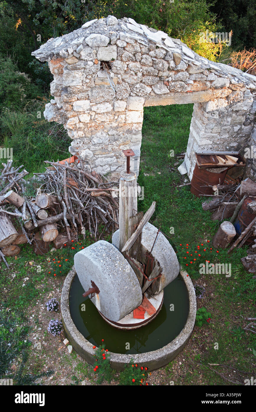 An old stone wheel used for crushing olives Stock Photo - Alamy