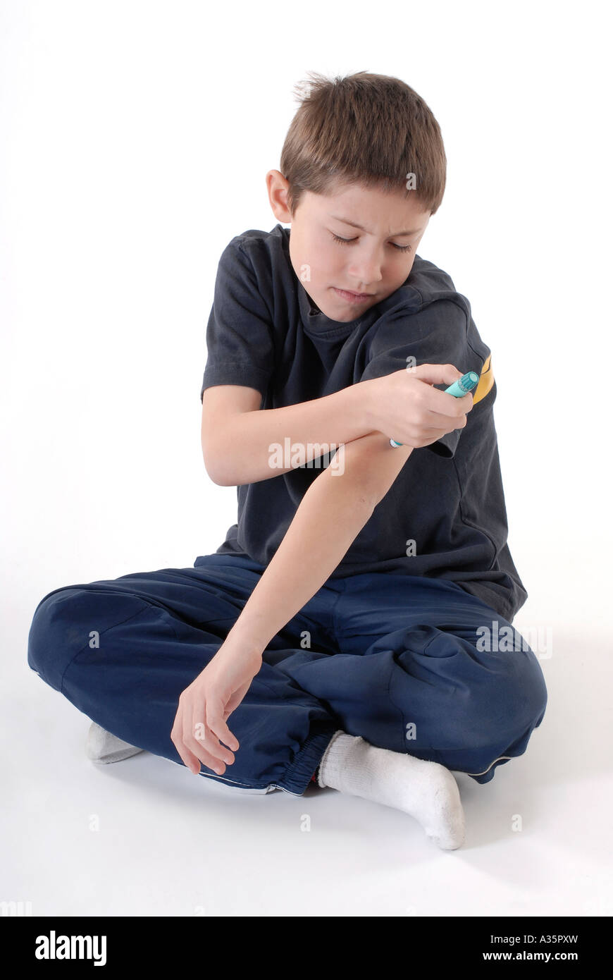 Boy giving himself insulin injection in the arm Stock Photo - Alamy