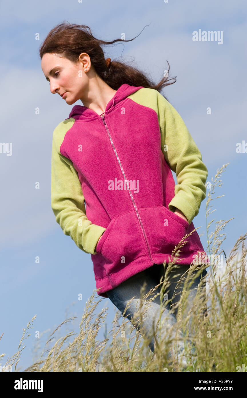 young woman with blue sky in the background Stock Photo - Alamy