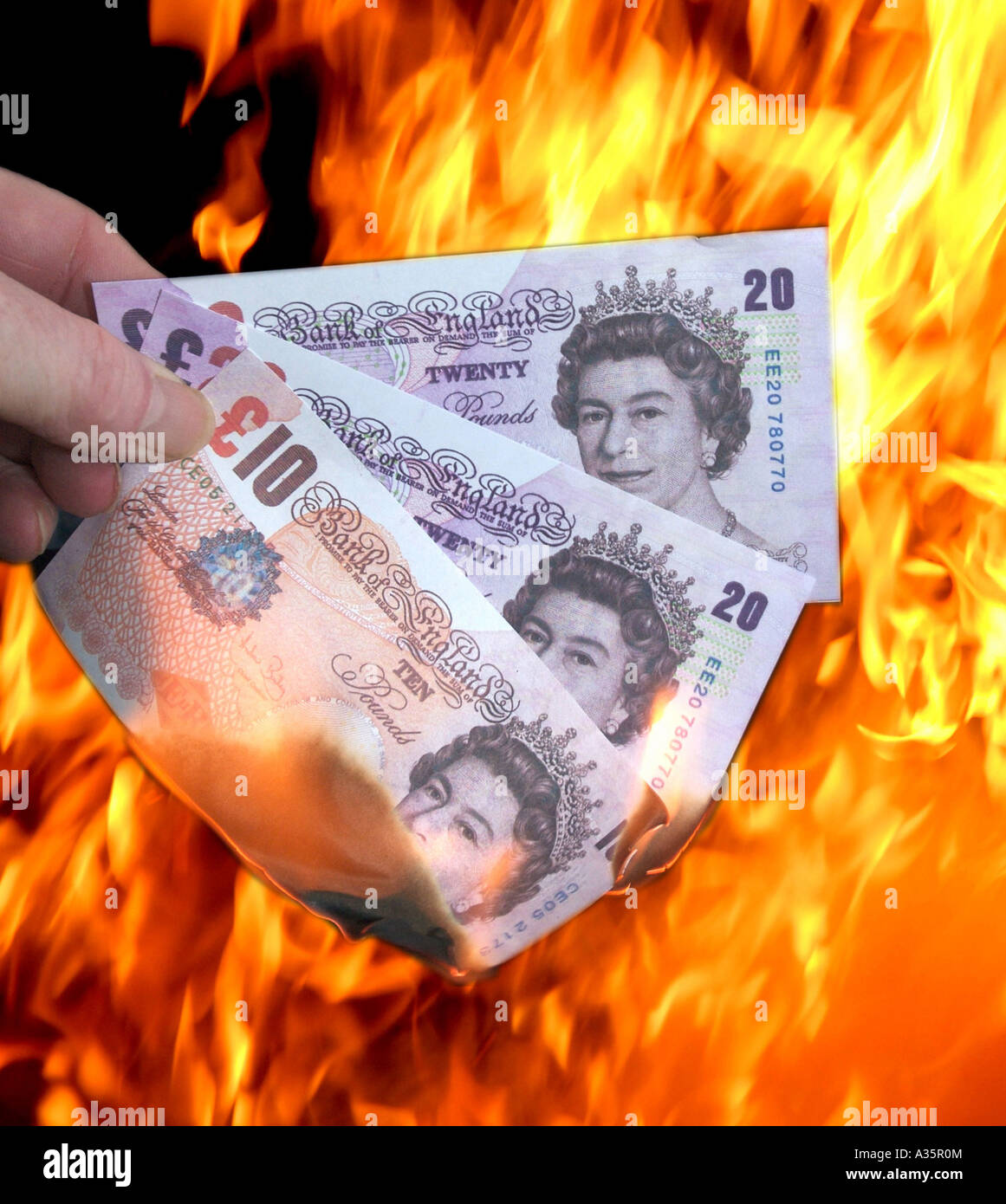 Burning cash hi-res stock photography and images - Alamy