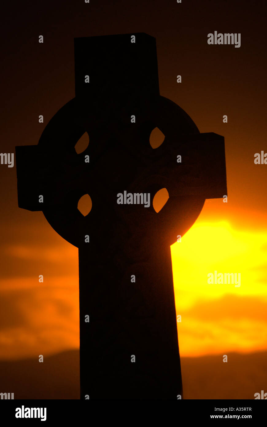 Celtic Cross at sunset in a graveyard in the City of Inverness in the ...