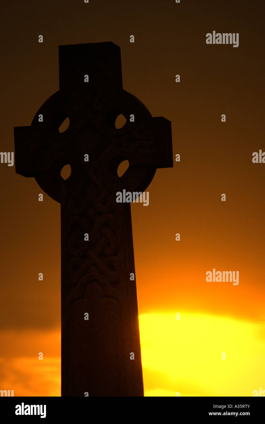 Celtic Cross at sunset in a graveyard in the City of Inverness in the ...