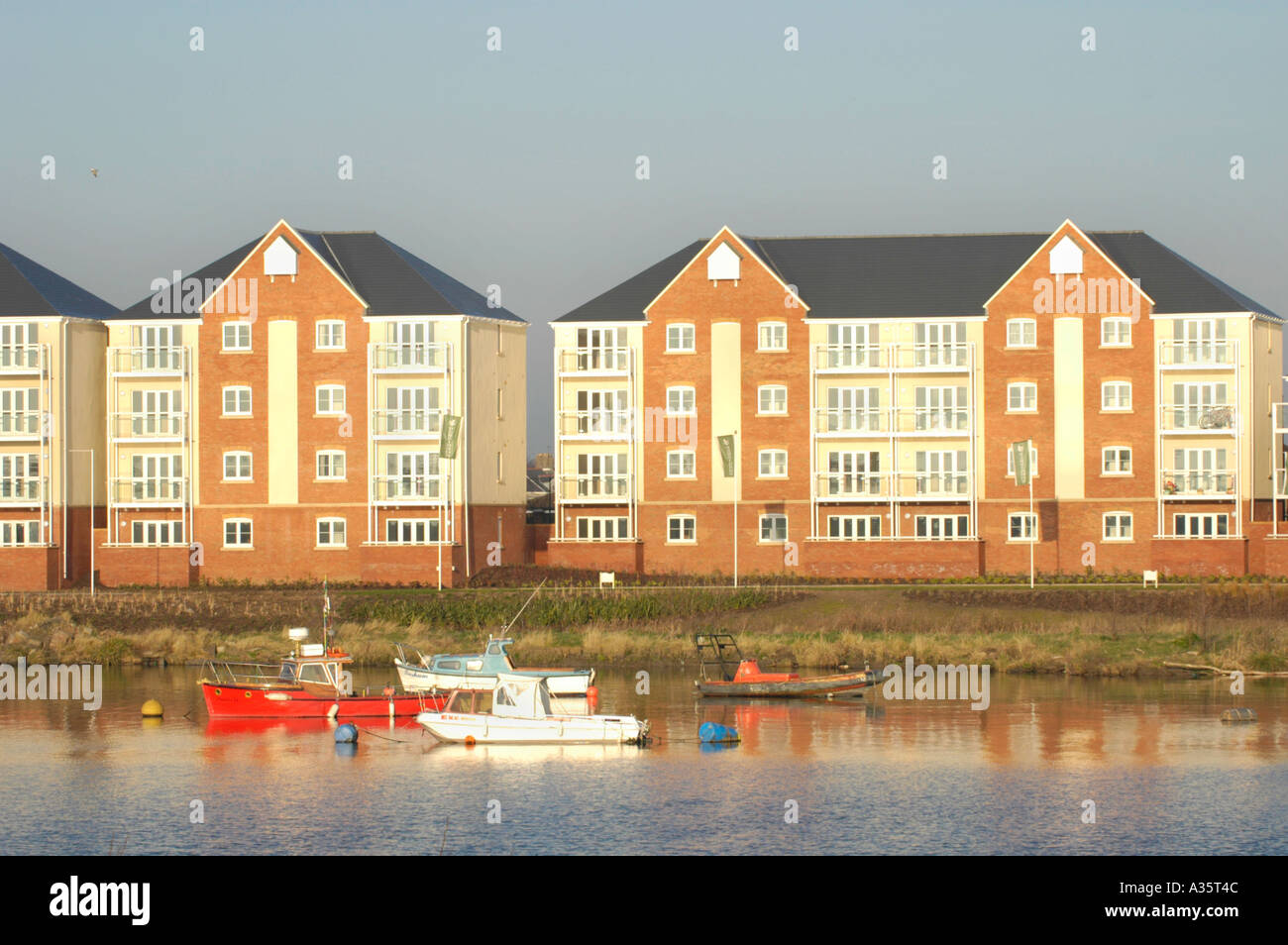 Modern apartment buildings overlooking Cardiff Bay waterfront in early ...