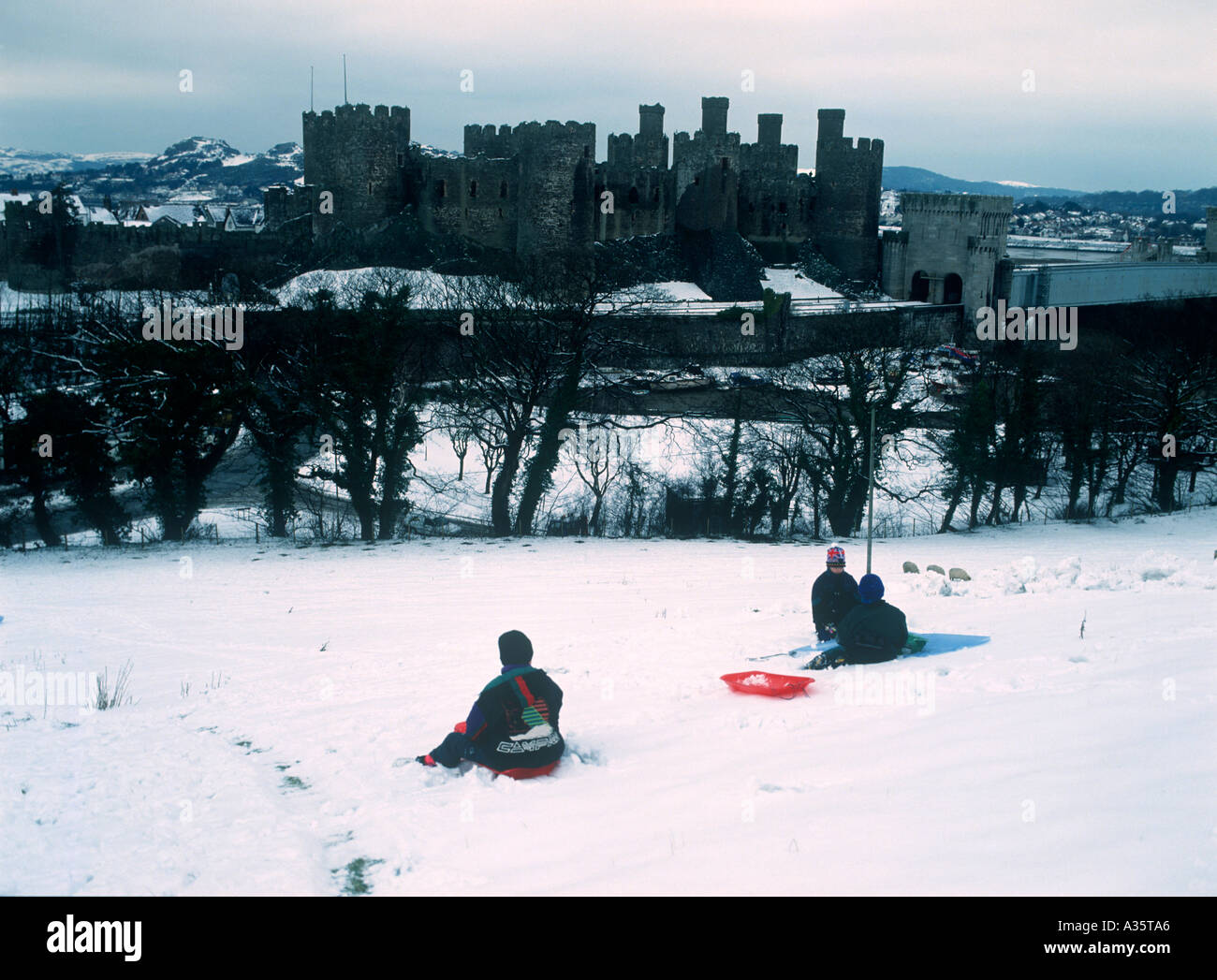Children Playing in Snow Conwy Castle North West Wales Stock Photo - Alamy