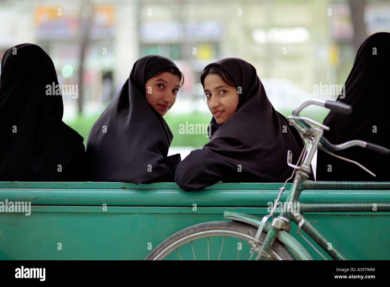 Young Iranian women at a bus stop in Esfahan, Iran Stock Photo - Alamy