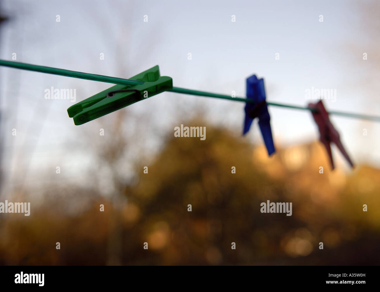 Pegs on a clothes line Stock Photo - Alamy