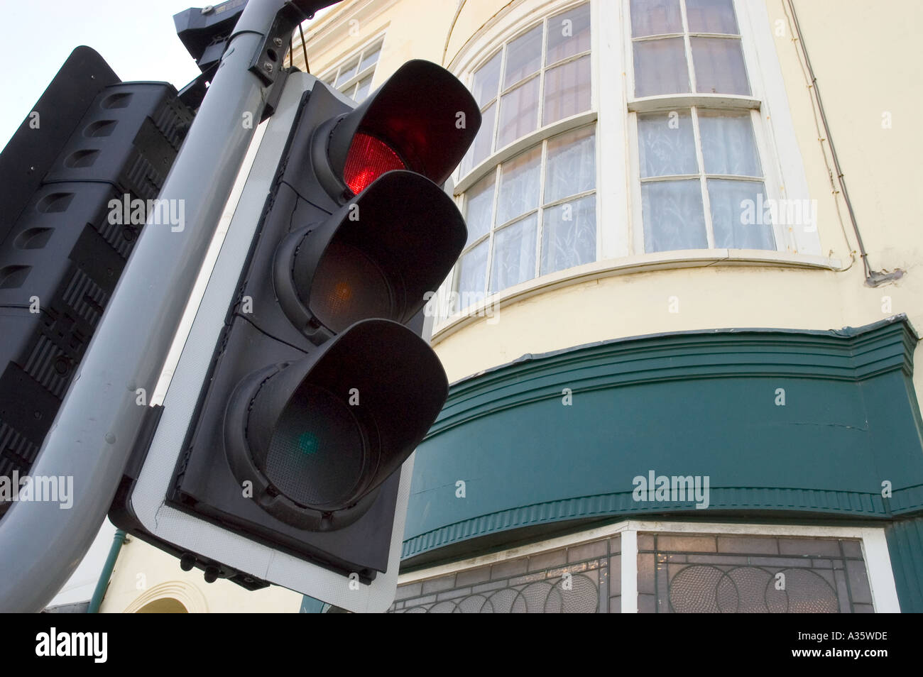 red traffic light in front of bow window Stock Photo - Alamy