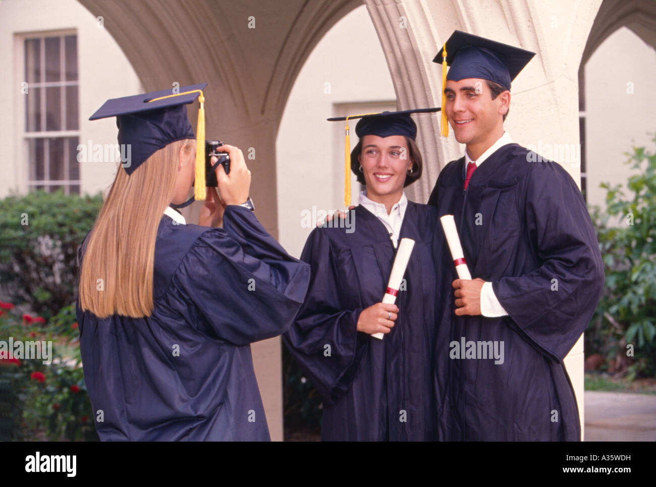 Graduates with Camera Stock Photo - Alamy