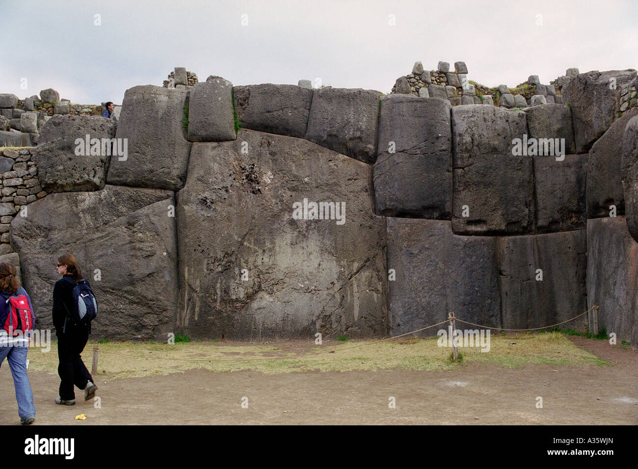An ancient Inca built stone wall at the site of Saqsaywaman. Cuzco ...