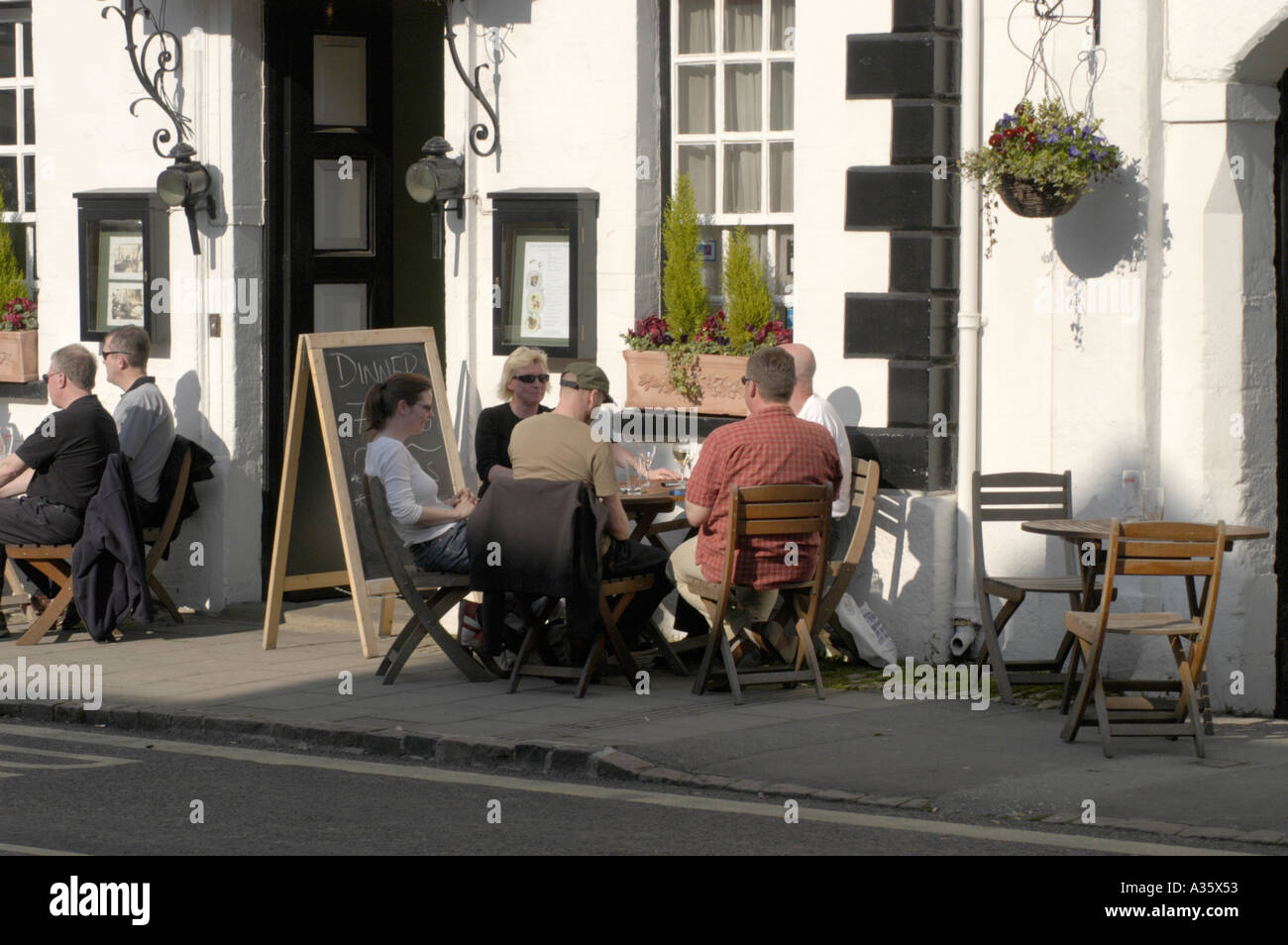 people drinking outside an English country pub Stock Photo - Alamy