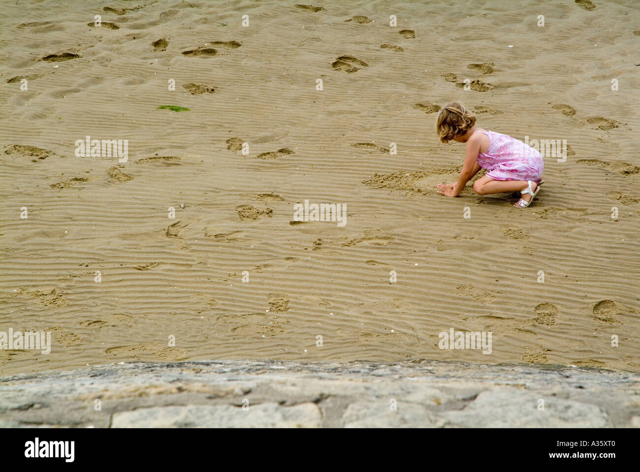 Little girl playing in the sand Bassin d Arcachon in France Stock Photo ...