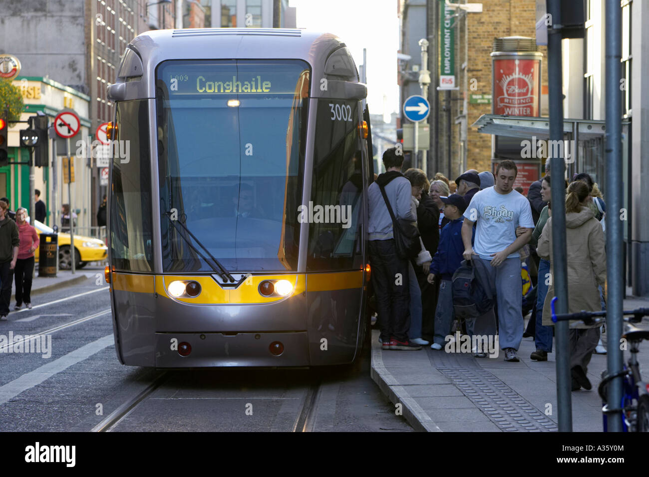 passengers disembarking the LUAS dublins new tram system at Abbey ...