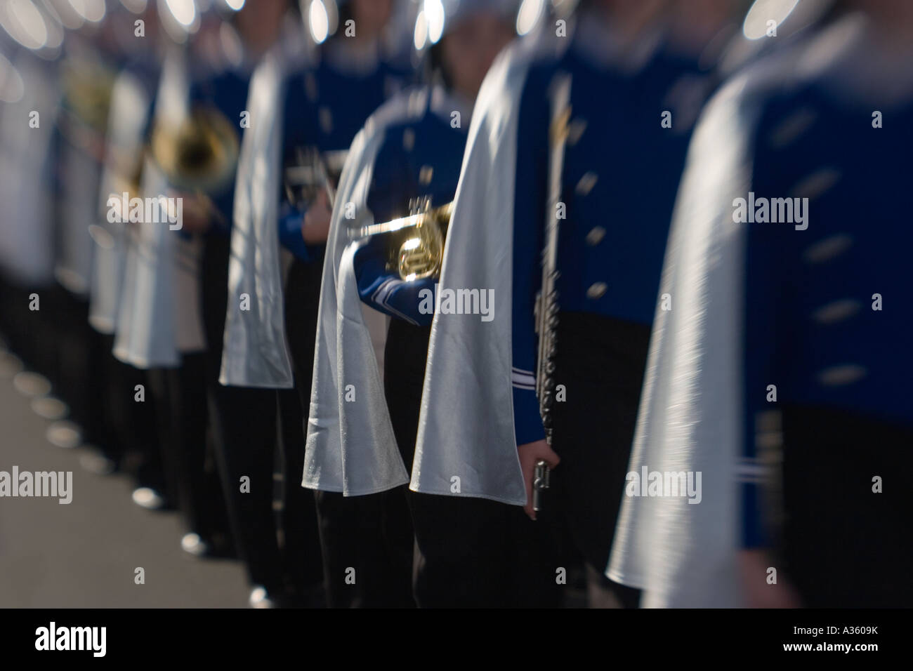 Uniformed musicians are lined up and ready for the start of a big ...