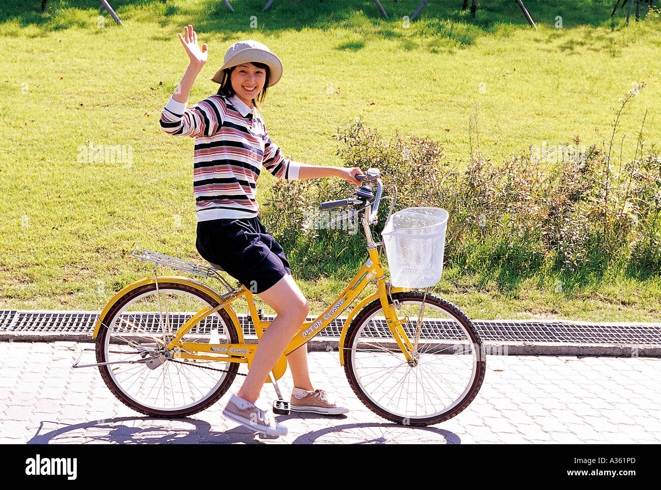 A girl riding a bicycle Stock Photo - Alamy