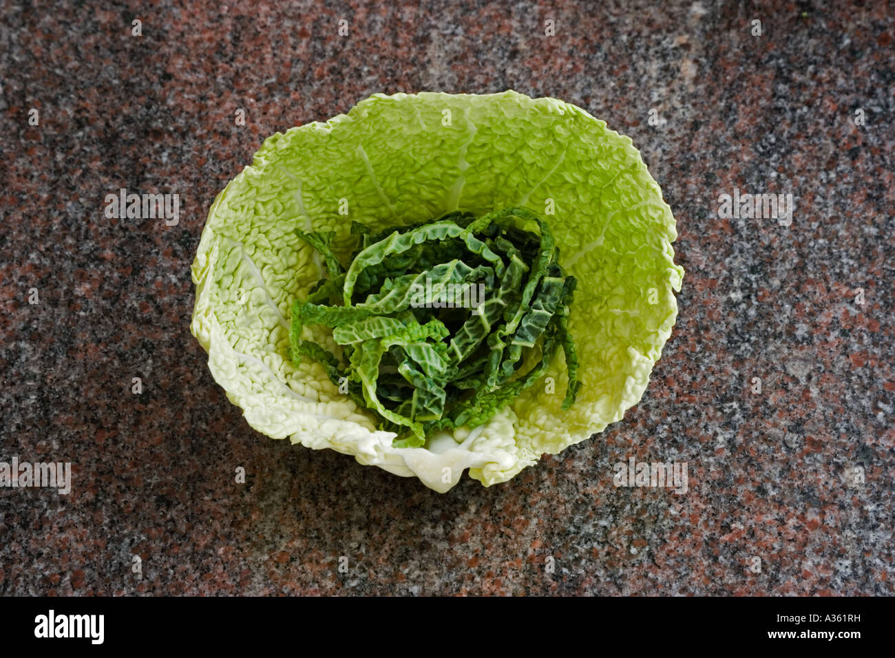 Green cabbage leaf holding sliced cabbage Stock Photo - Alamy