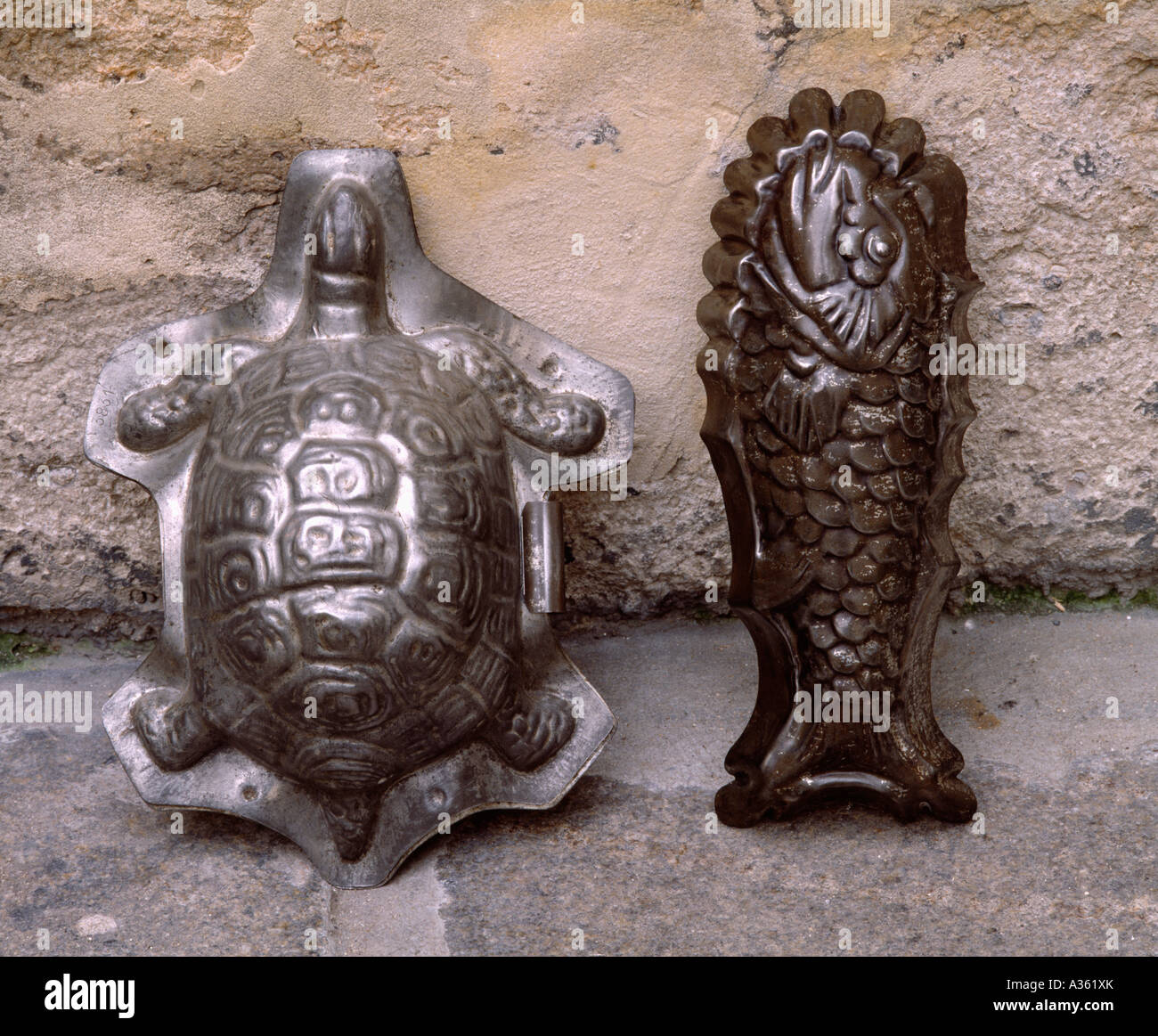 Antique metal fish moulds Stock Photo - Alamy