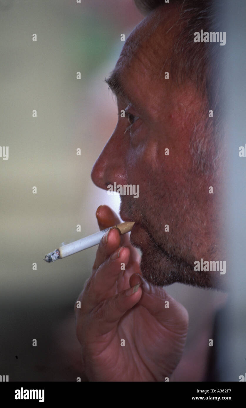 Man Smoking Cigarette Stock Photo - Alamy