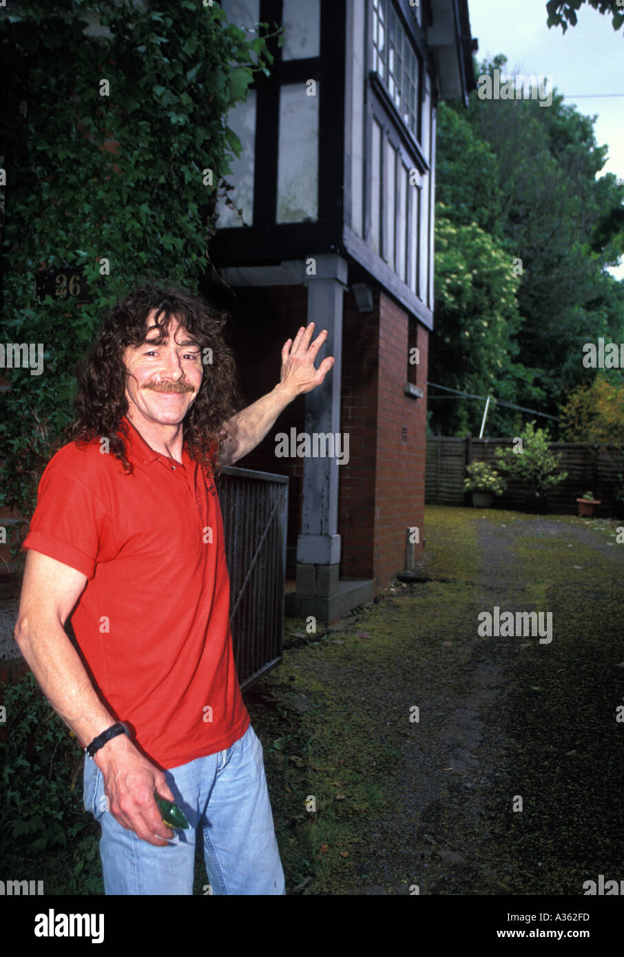 Man Pointing to Building Stock Photo - Alamy