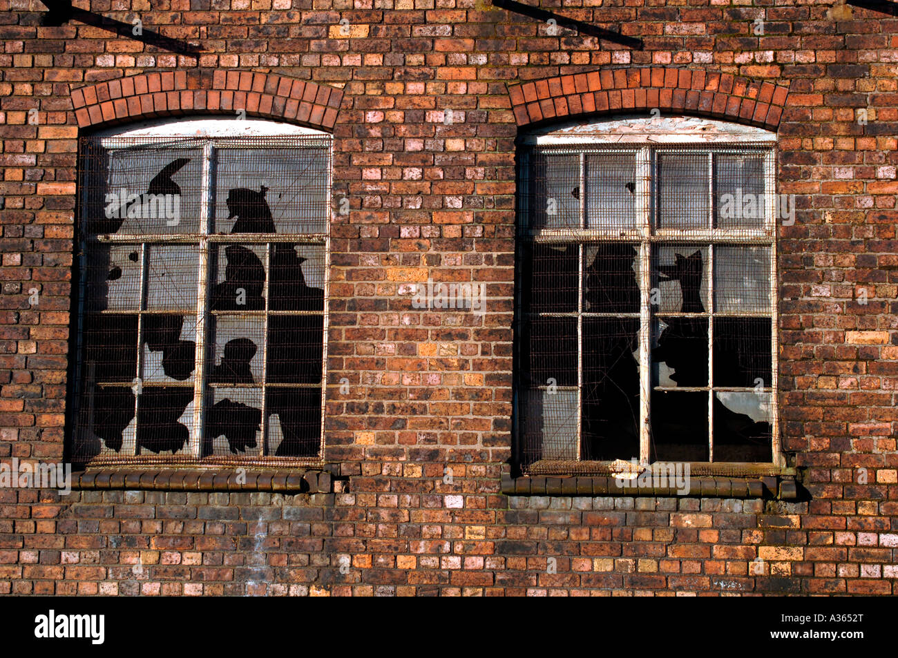 Broken Windows Of A Derelict Factory Stock Photo - Alamy