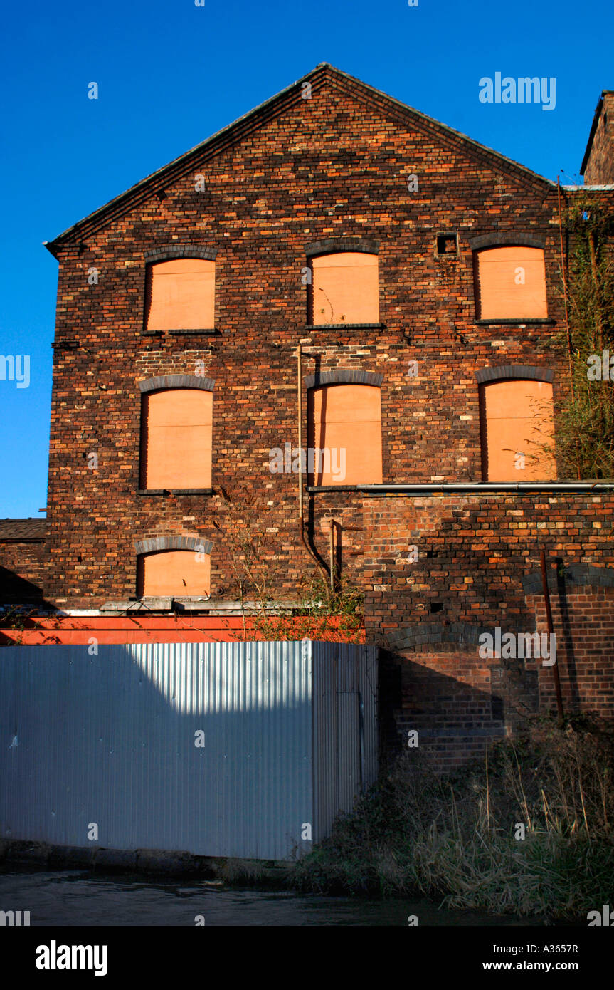 Disused Factory,With All Its Windows Boarded Up Stock Photo - Alamy