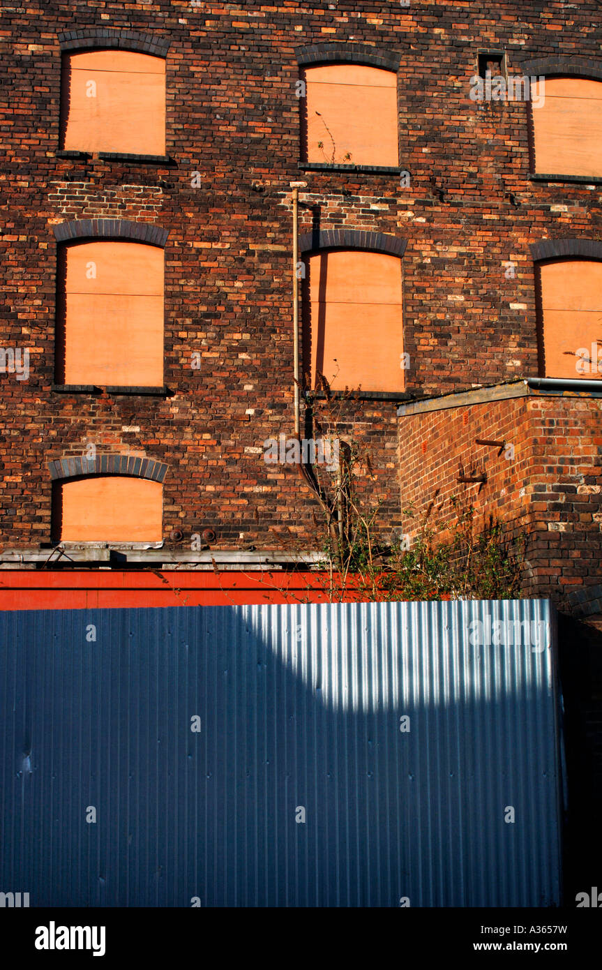 Disused Factory,With All Its Windows Boarded Up Stock Photo - Alamy