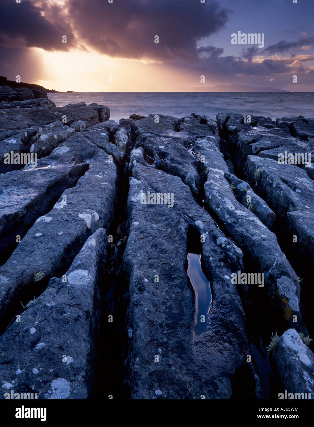 Sunburst over Rum viewed from Elgol, Isle of Skye Stock Photo - Alamy