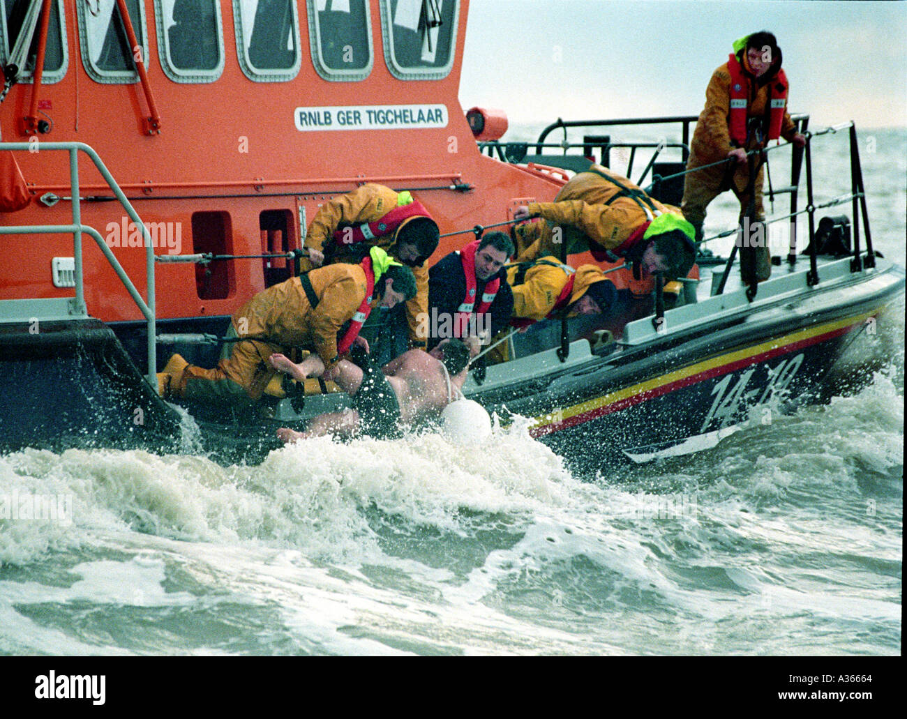 Lifeboat crew teamwork hi-res stock photography and images - Alamy