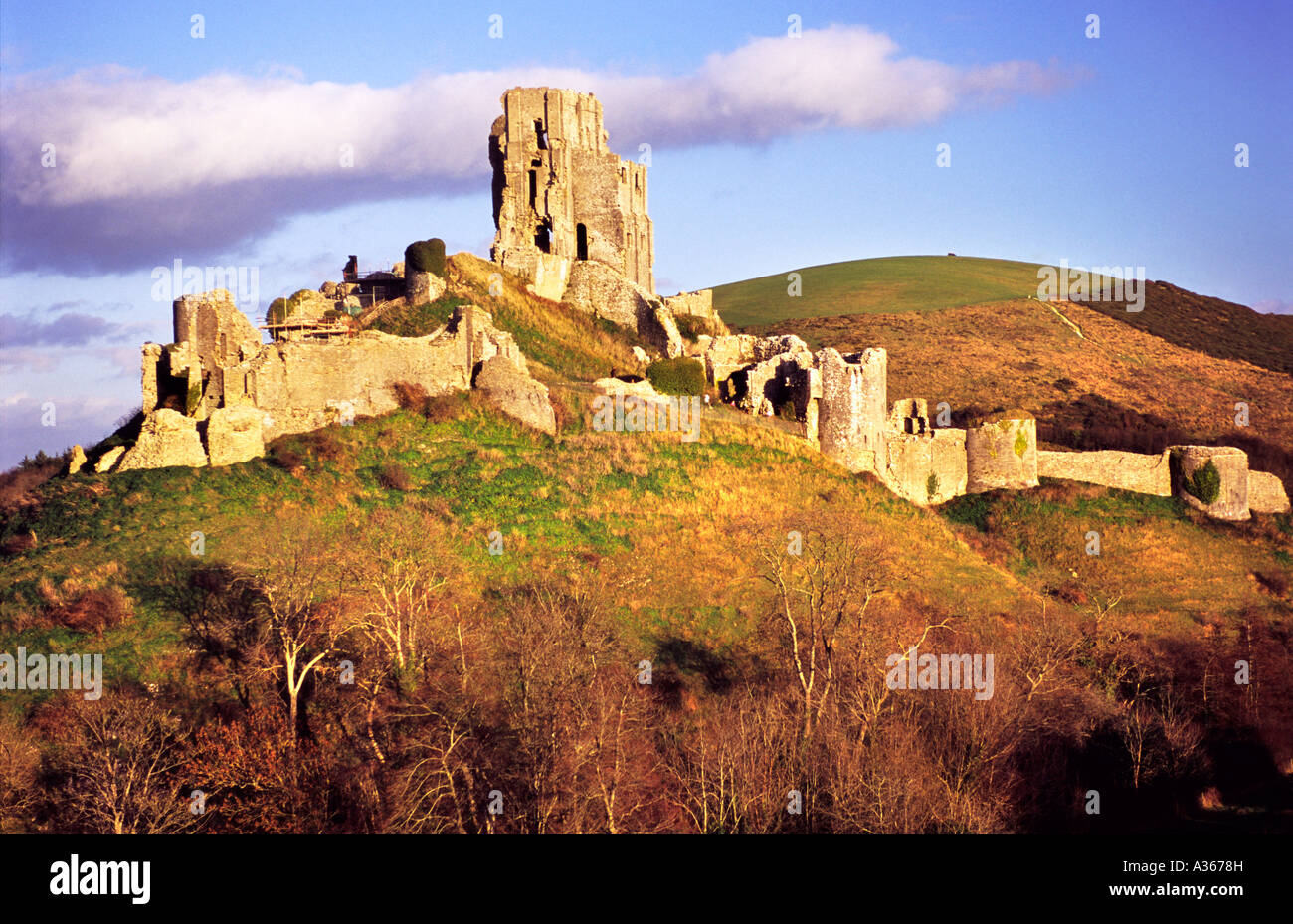Winter view of Corfe Castle Dorset in late afternoon sunlight as seen ...