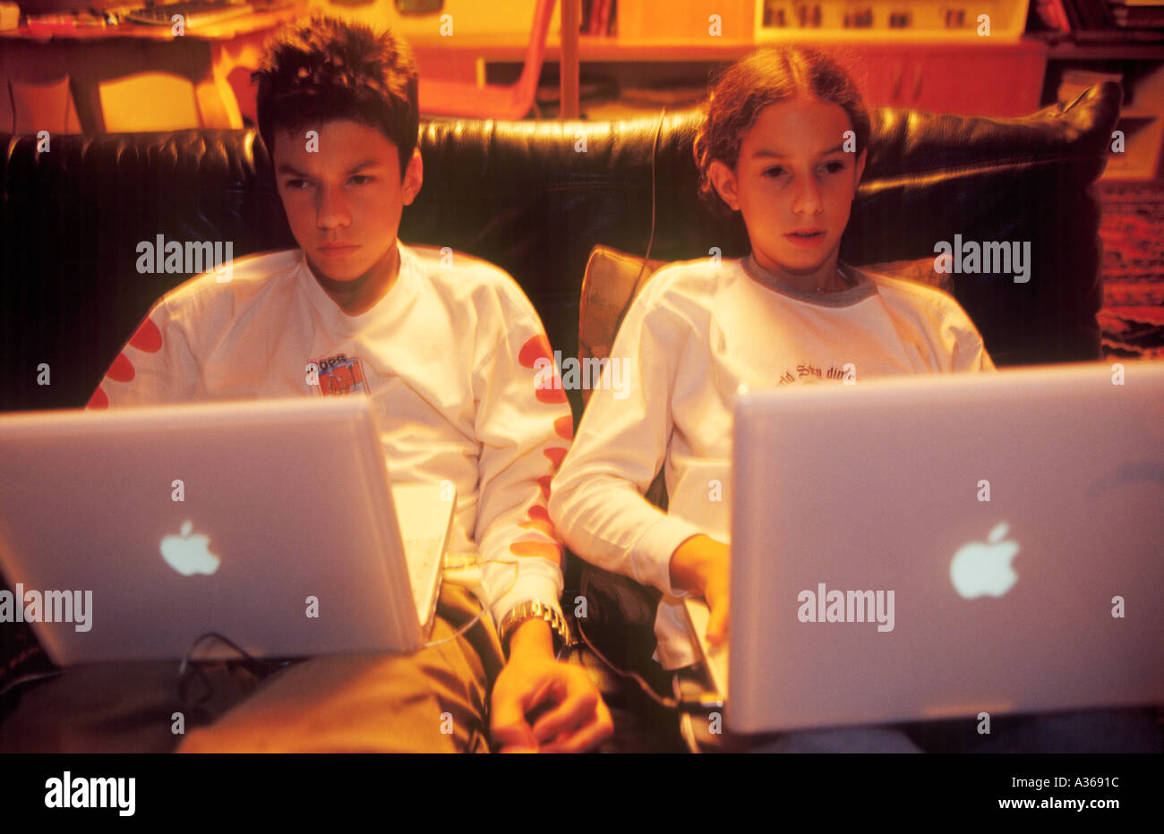 Boy and girl with laptop computers Stock Photo - Alamy