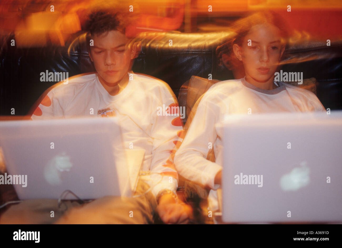 Boy and girl with laptop computers Stock Photo - Alamy