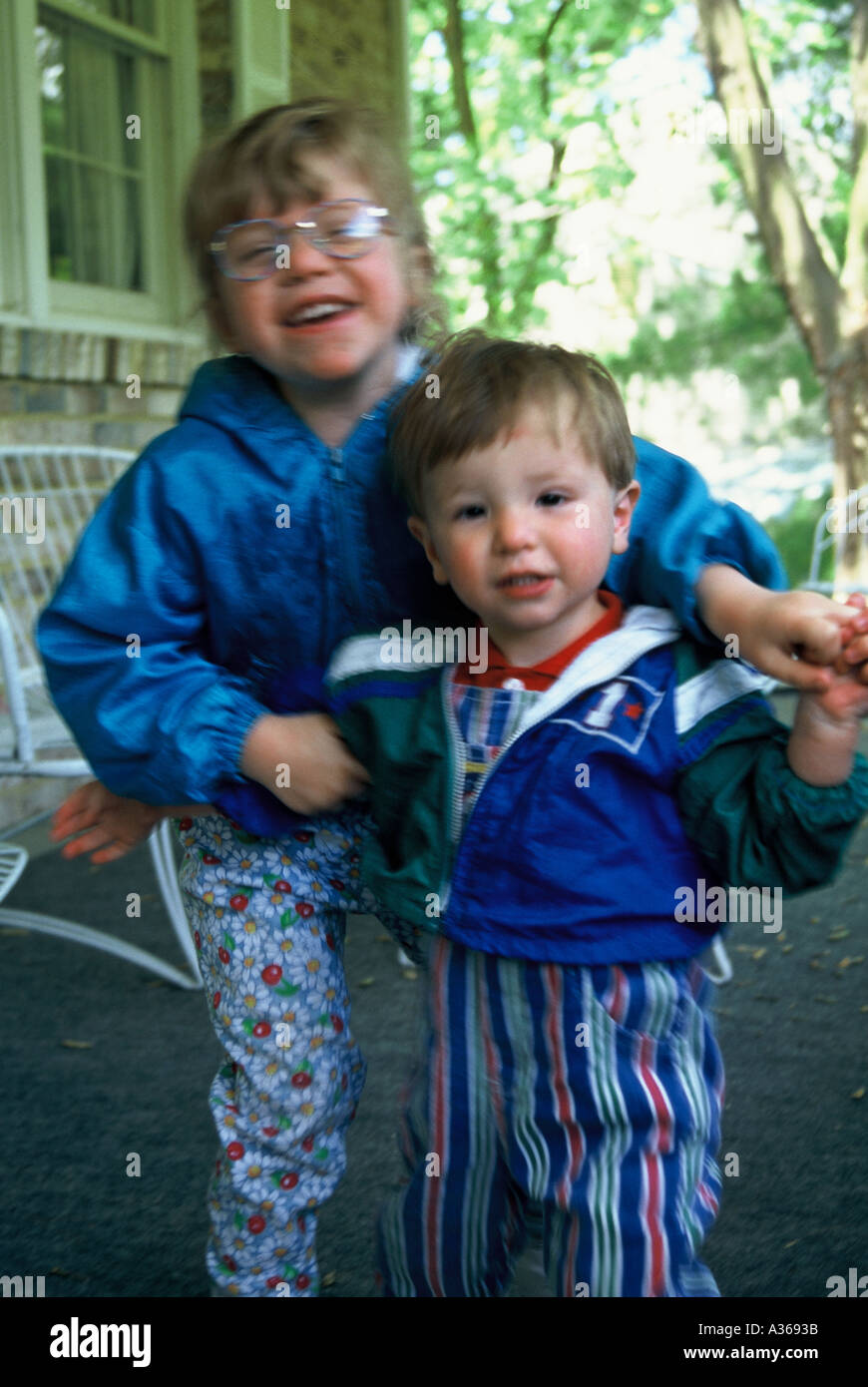 kids on porch playing brother and sister Stock Photo - Alamy