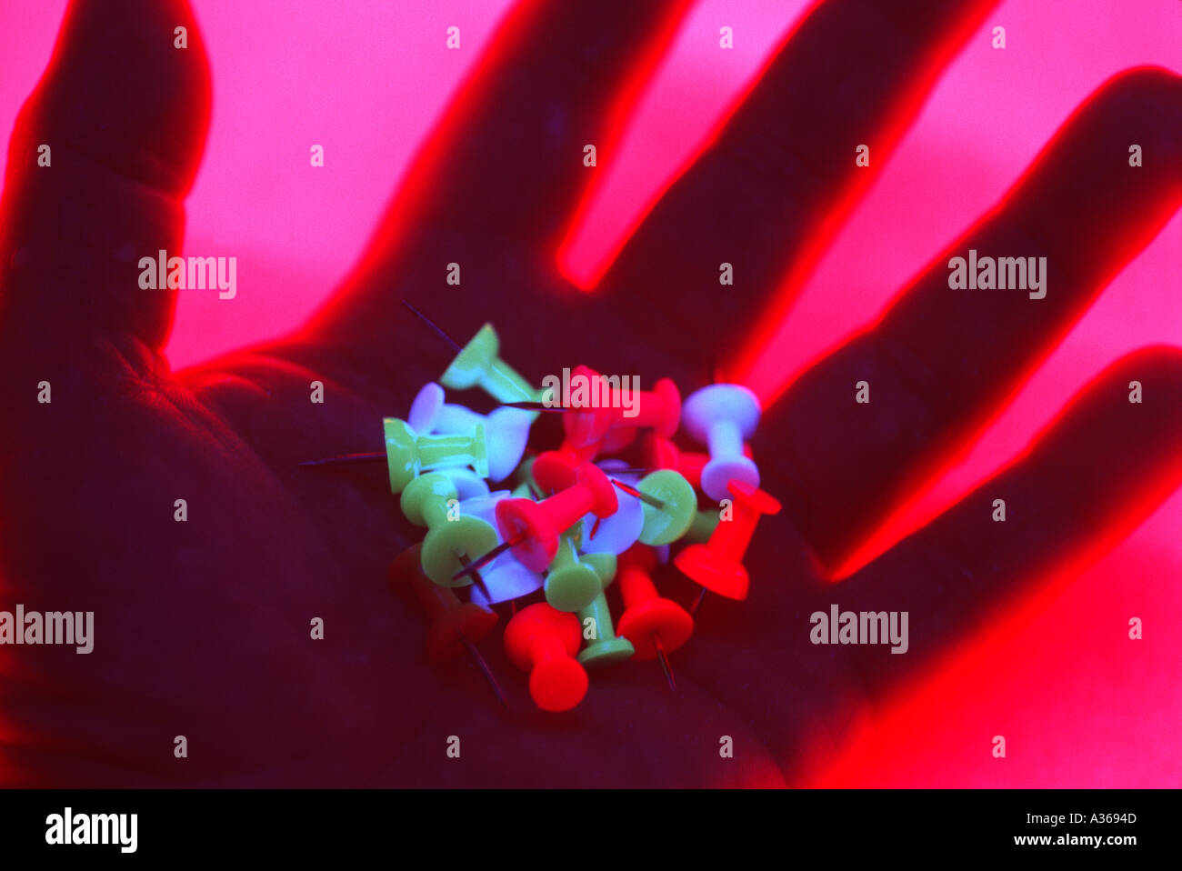 Hand with drawing pins Stock Photo - Alamy