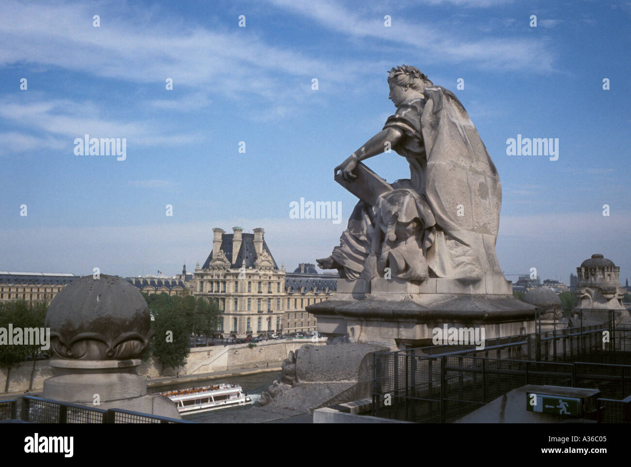 View from outdoor terrace showing statue with river and Louvre in ...
