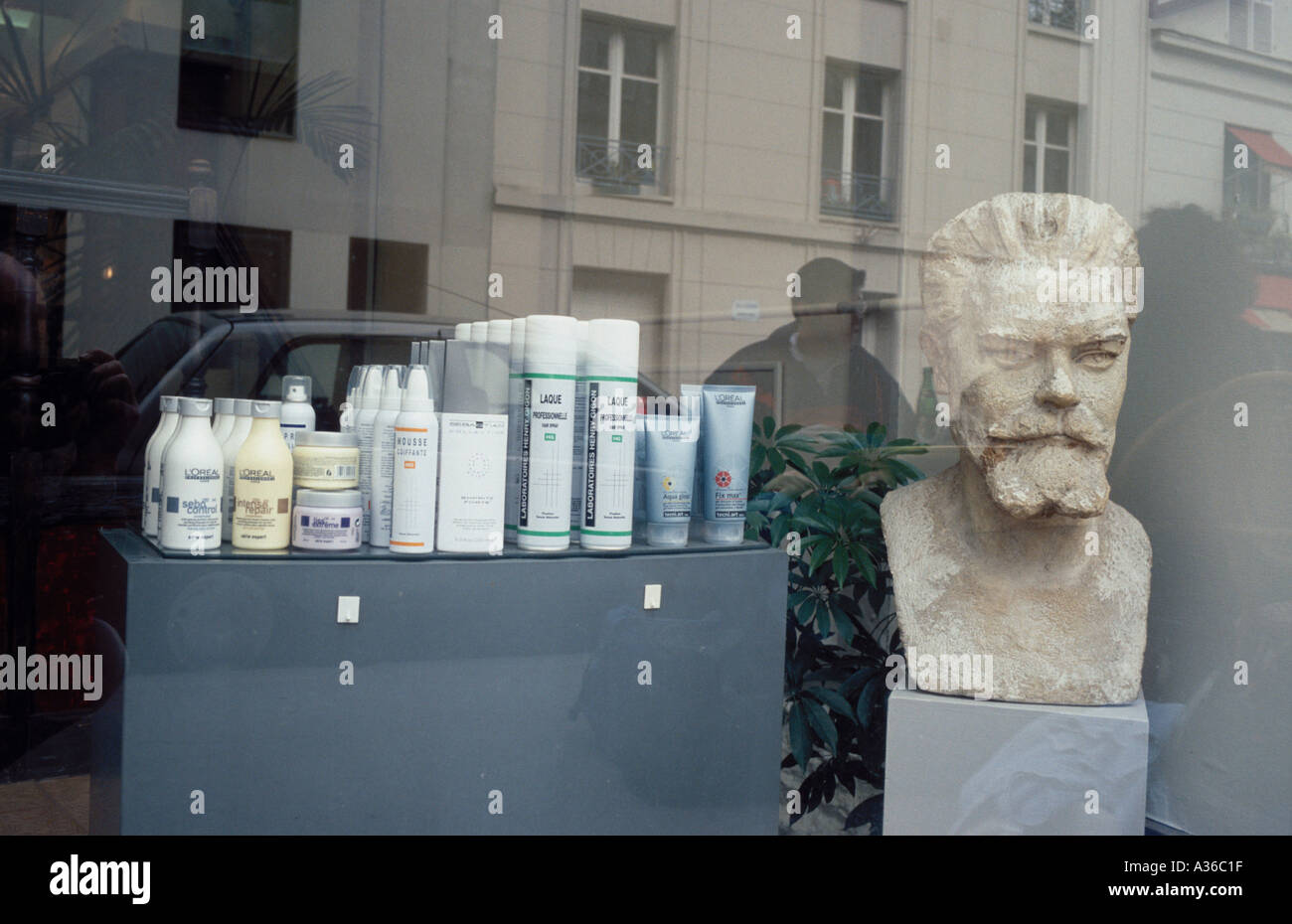 Male bust in window of coiffure salon Stock Photo - Alamy
