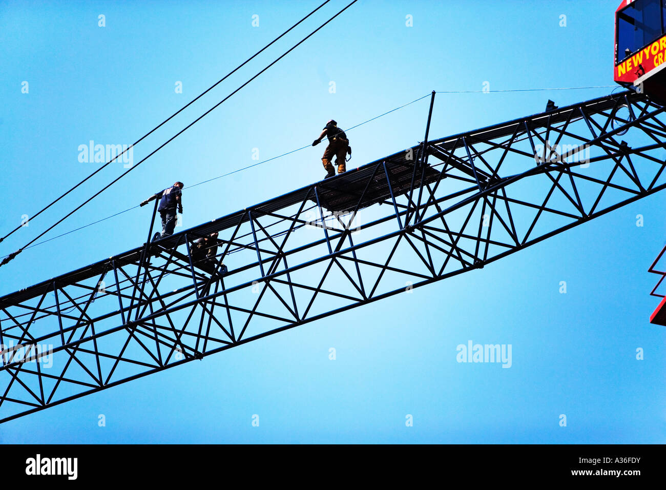 CONSTRUCTION WORKERS ON CRANE Stock Photo - Alamy