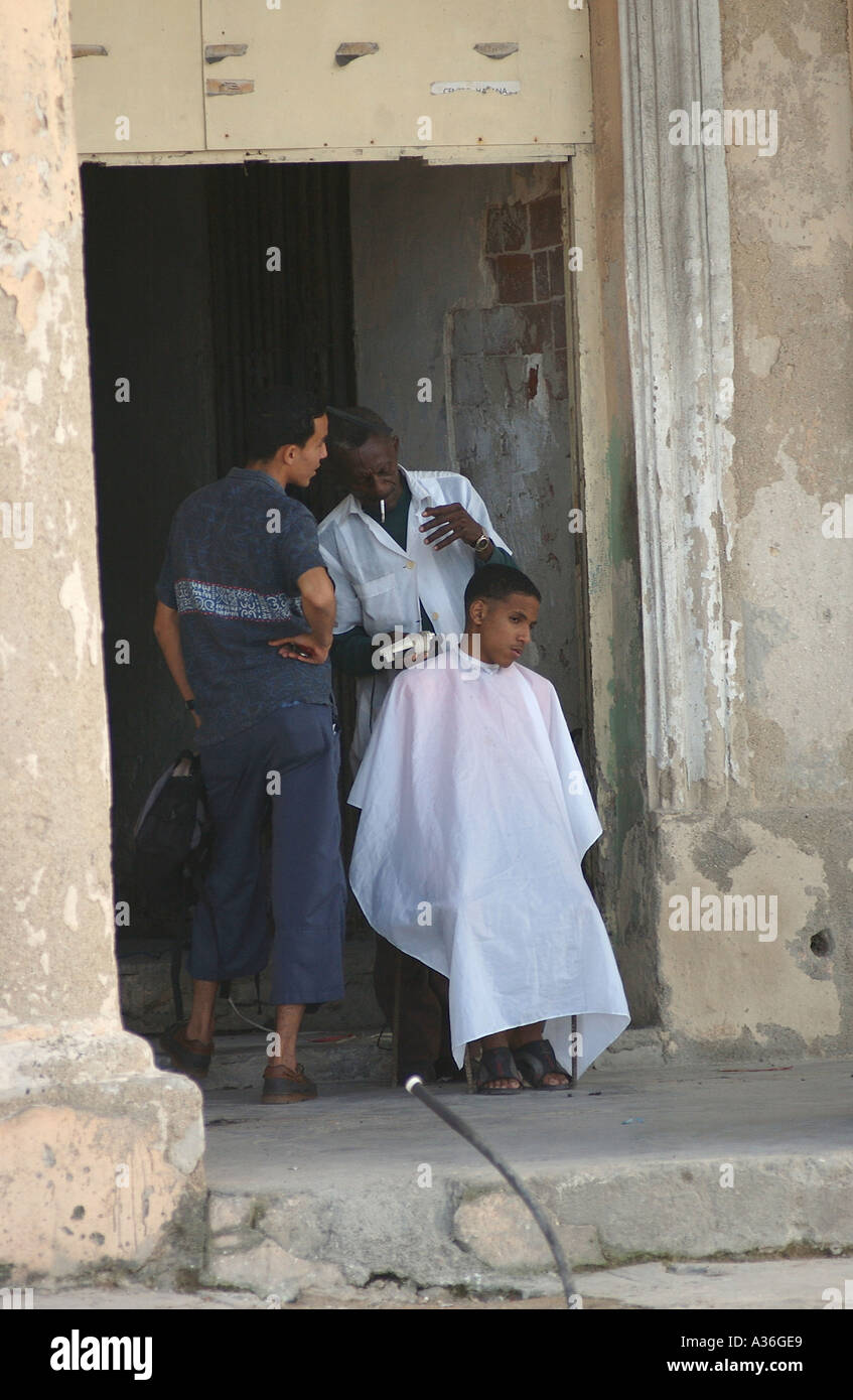 Barber cutting a boys hair Havana Cuba Stock Photo - Alamy