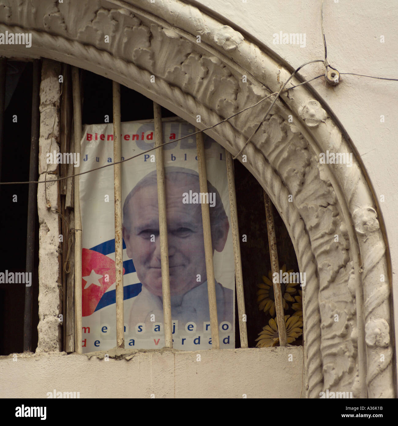 Picture of the pope seen through bars of an arched window Havana Cuba ...