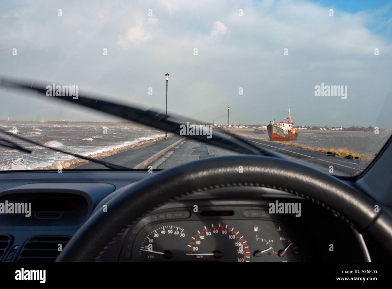 Stormy Day A rain swept and wind swept road viewed from inside a car ...