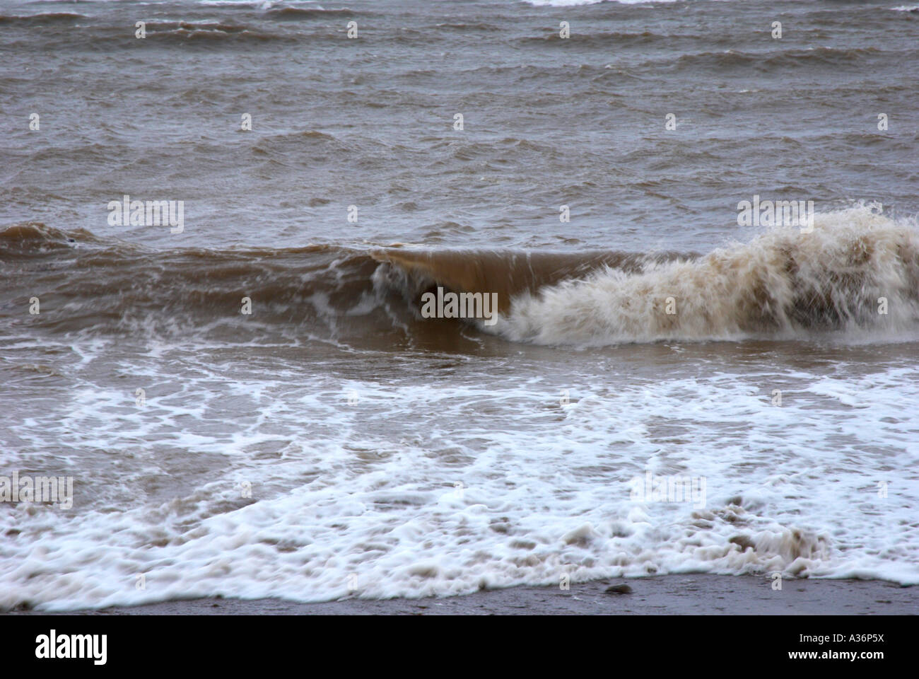 Breakwater Tidal waves breaking on a shoreline Stock Photo - Alamy