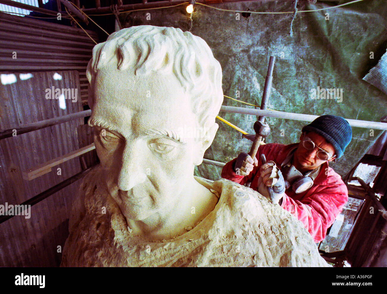 Sculptor Tim Lees of Cliveden Conservation works on a 10 ft 6 inch high ...