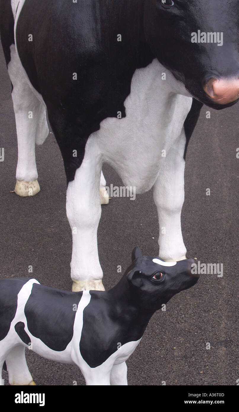 Concrete life size model black and white cow Stock Photo - Alamy