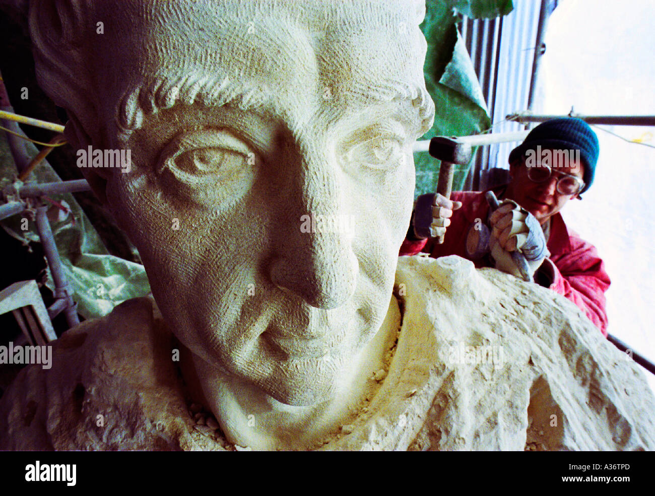 Sculptor Tim Lees of Cliveden Conservation works on a 10 ft 6 inch high ...