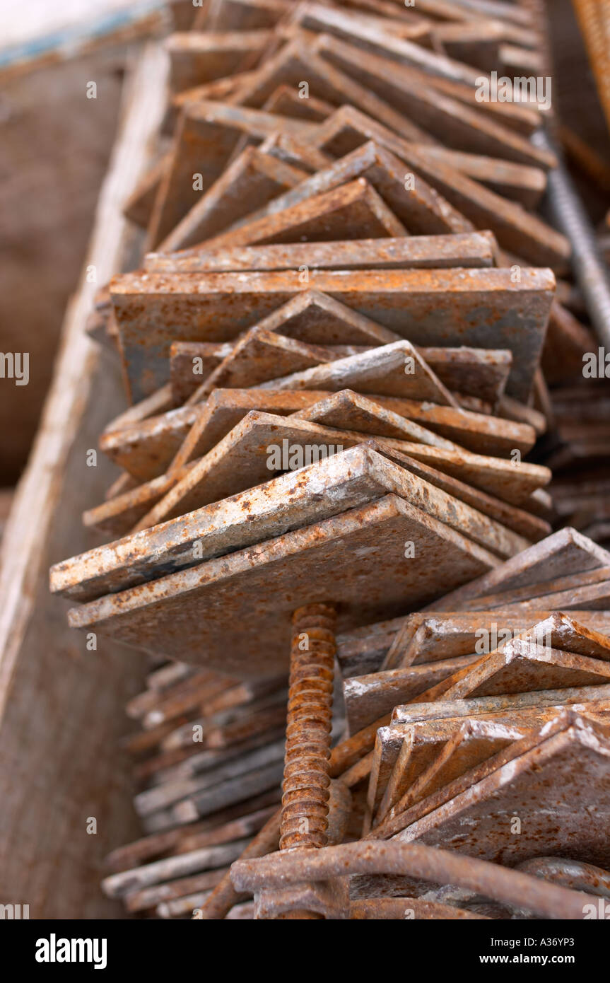 Rusted metal squares on a large screw. Industrial parts. Close-up ...