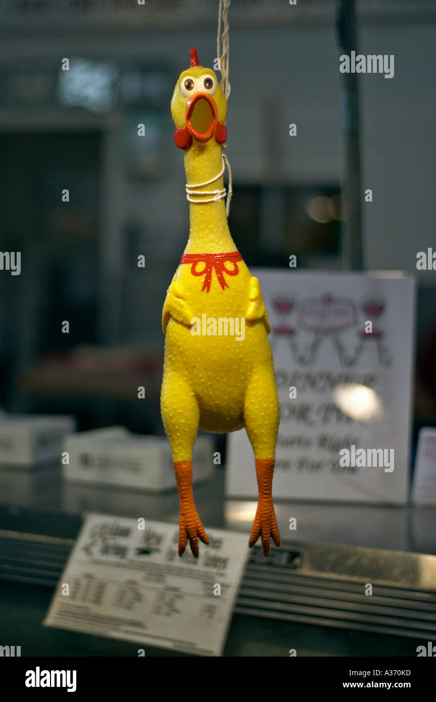 Bird figurine hanging on a rope Stock Photo - Alamy