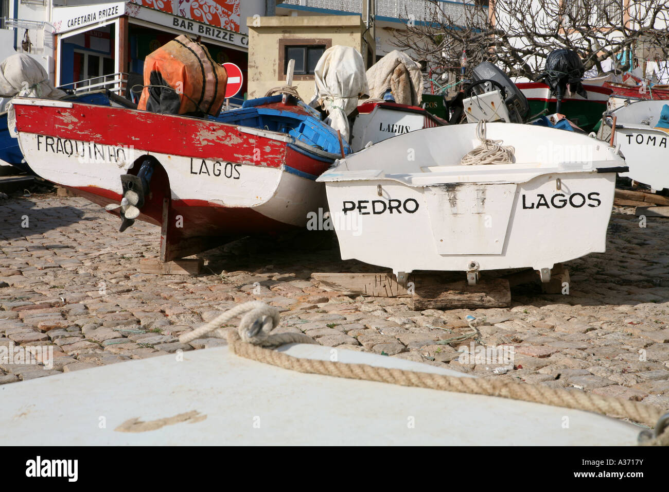 Fishing boats on a beach in portugal Stock Photo - Alamy